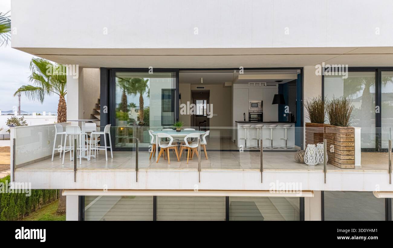Modern first-floor apartment featuring a stylish balcony with outdoor ...