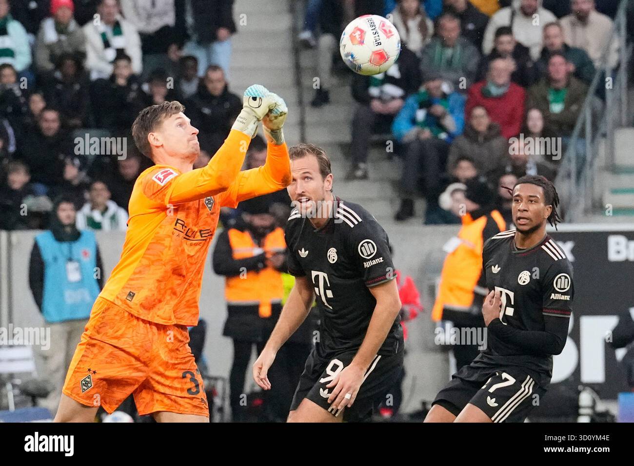 Moenchengladbach's goalkeeper Moritz Nicolas saves in front of Bayern's ...
