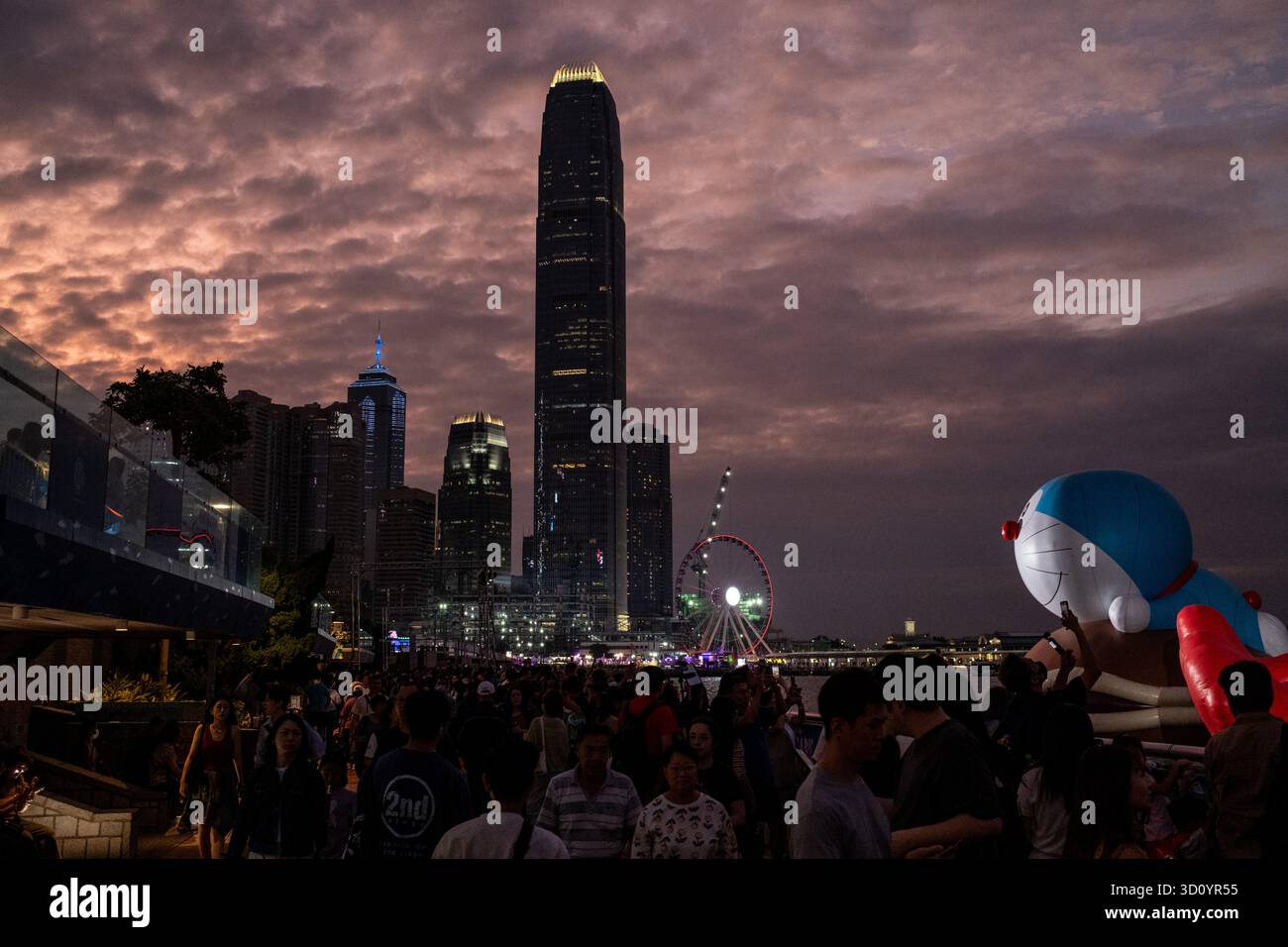 Hong Kong. 25th Oct 2025. People looking at Floating inflatable ...