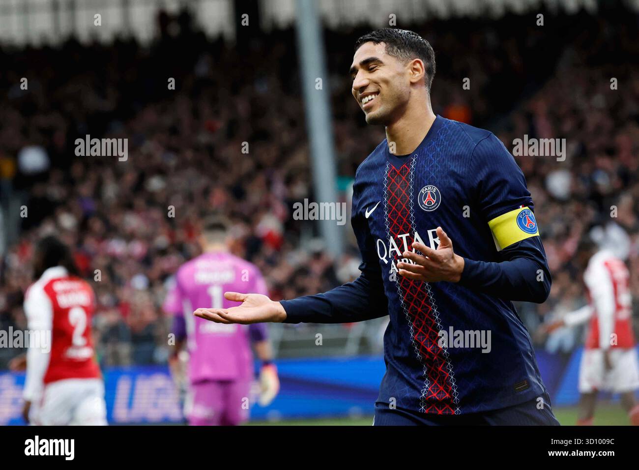 PSG's Achraf Hakimi celebrates after scoring his side's second goal ...