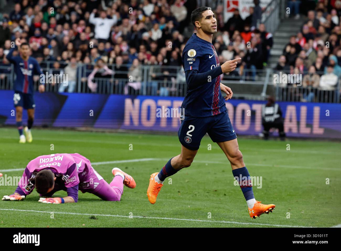 PSG's Achraf Hakimi celebrates after scoring his side's second goal ...
