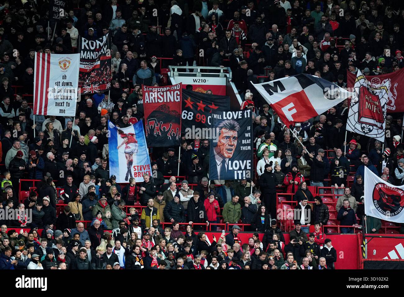 Manchester United fans holding banners in the crowd during the Premier ...