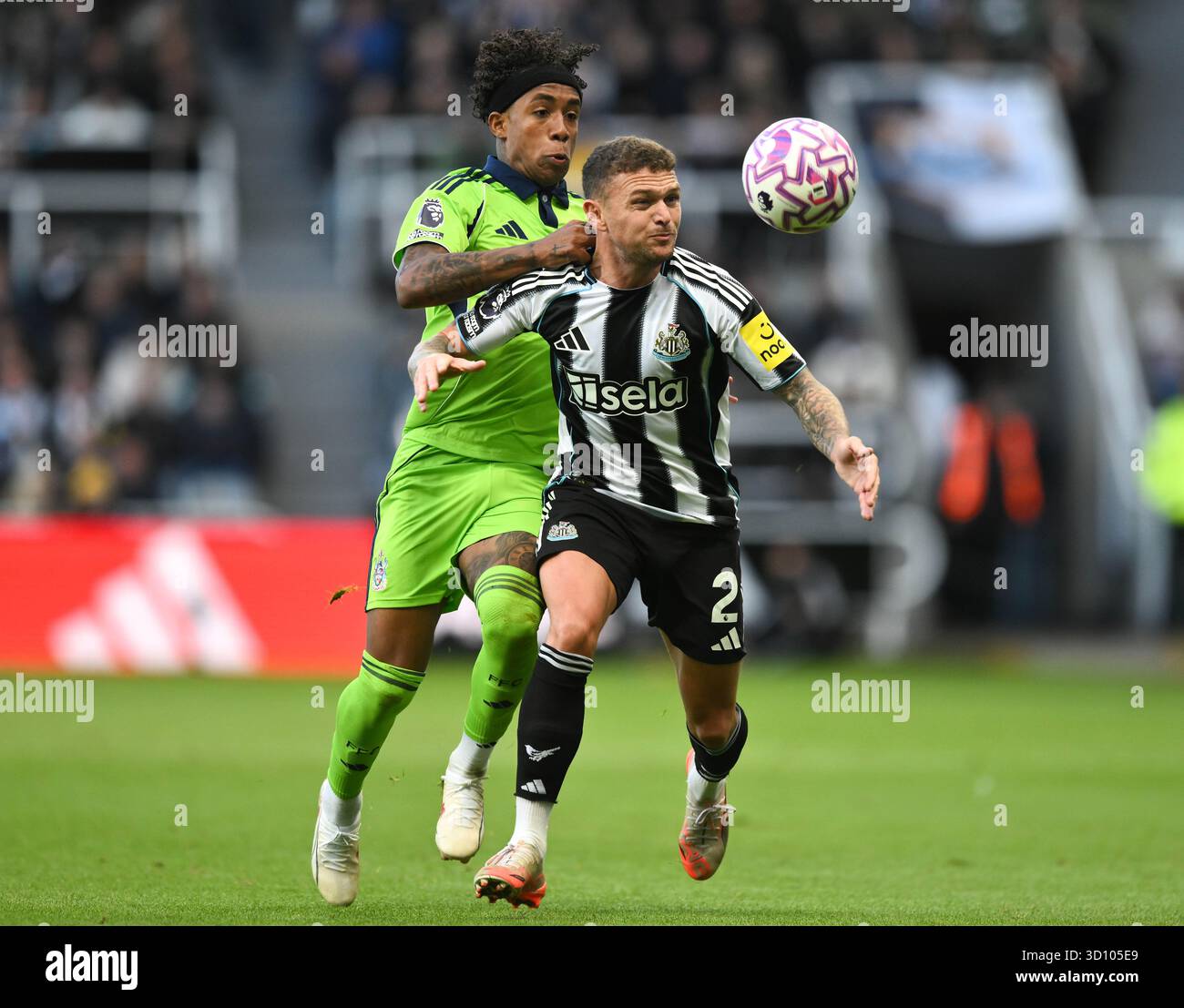 Kieran Trippier of Newcastle United fends off Kevin of Fulham during ...