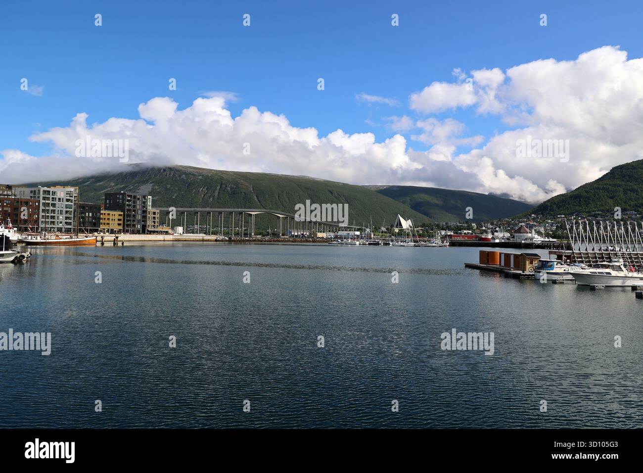 Port of the Norwegian city of Tromso with the Arctic Cathedral in the ...