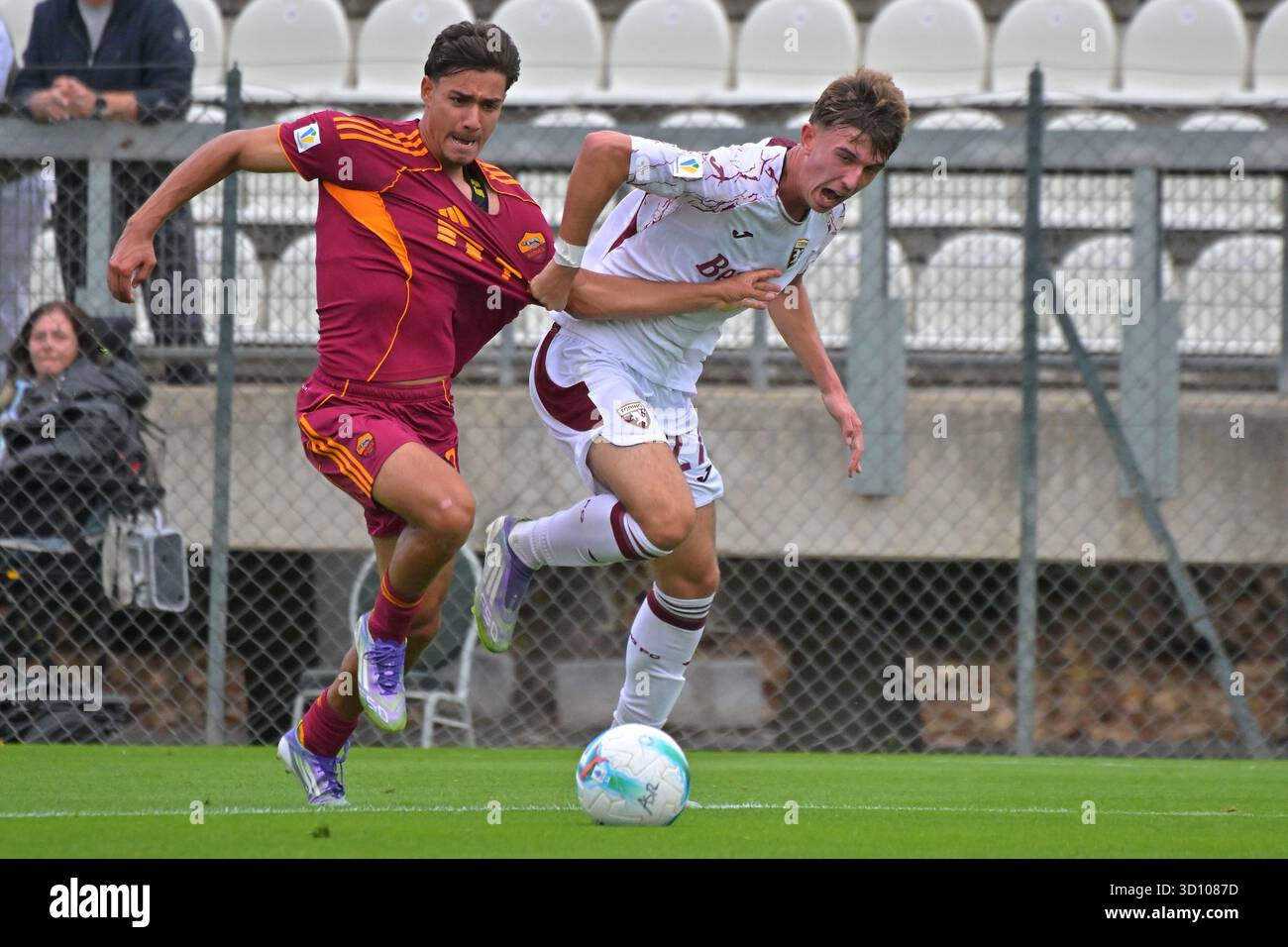 Emanuele Lulli (AS Roma) battles for possession with Zalan Kugyela ...