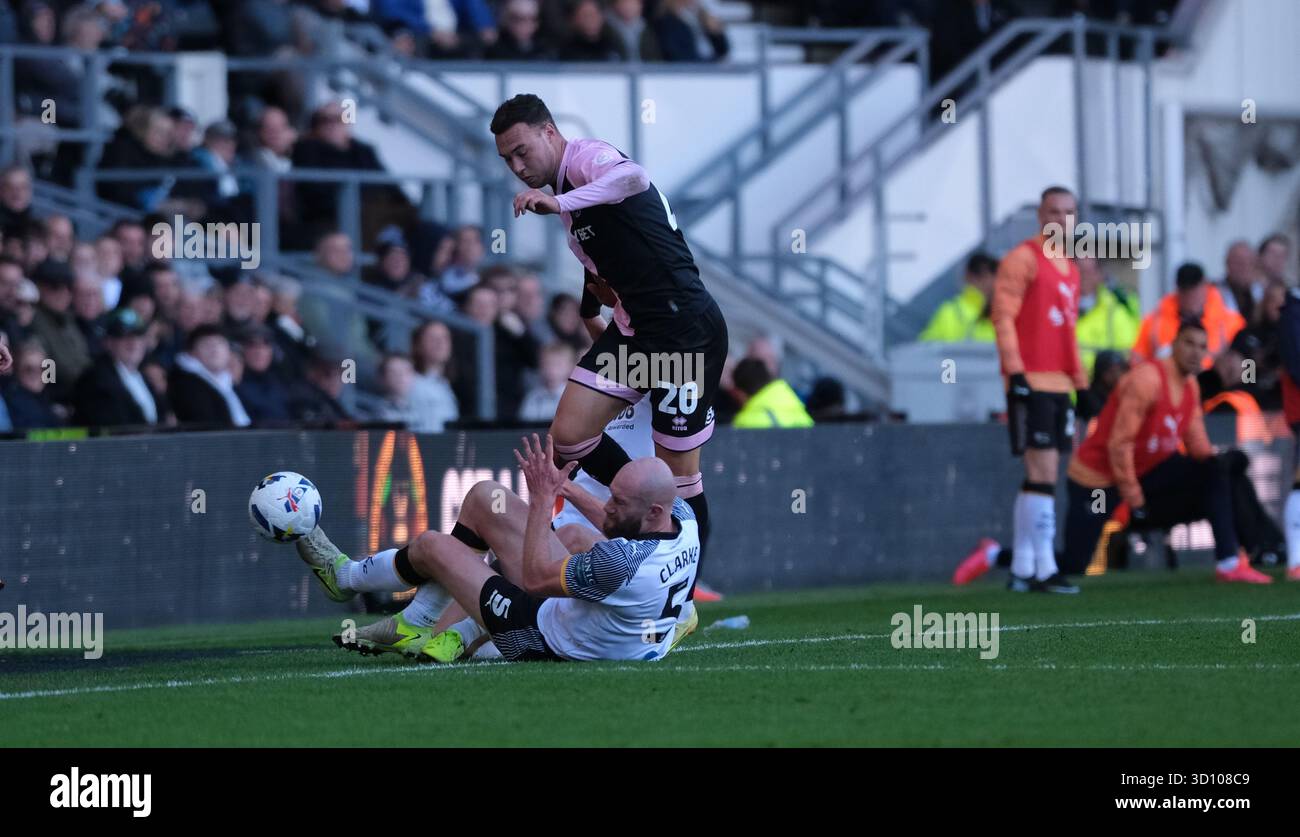 Matt Clarke of Derby County tackles Harvey Vale of Queens Park Rangers ...