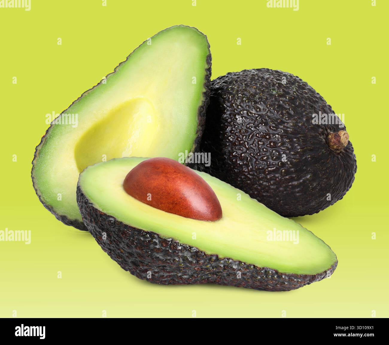 Fresh avocados on green gradient background. Whole and sliced Stock ...