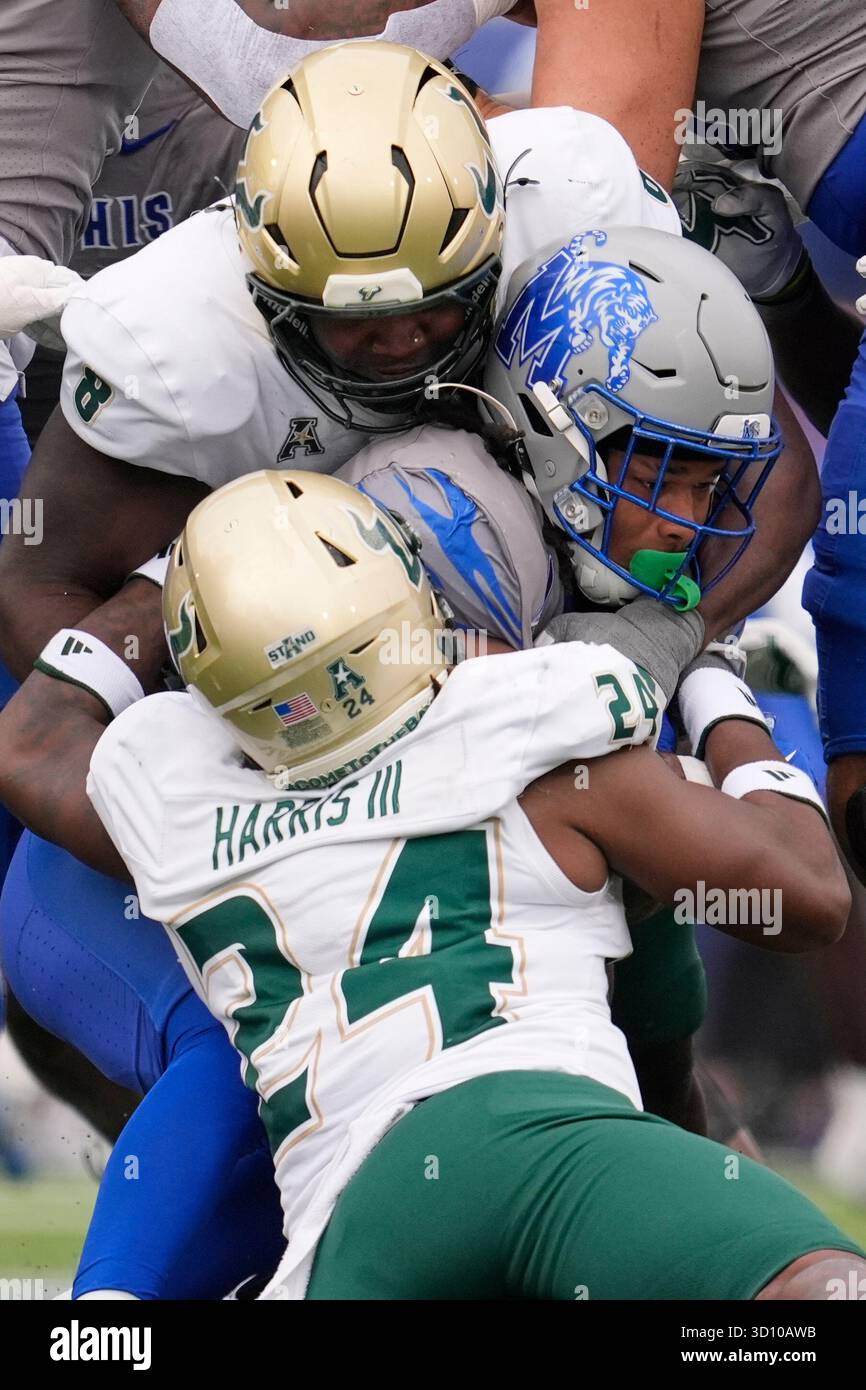 South Florida defensive lineman Traevon Mitchell (8) and linebacker Mac ...