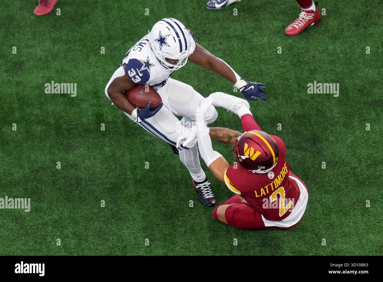 Dallas Cowboys running back Javonte Williams (33) breaks a tackle by ...