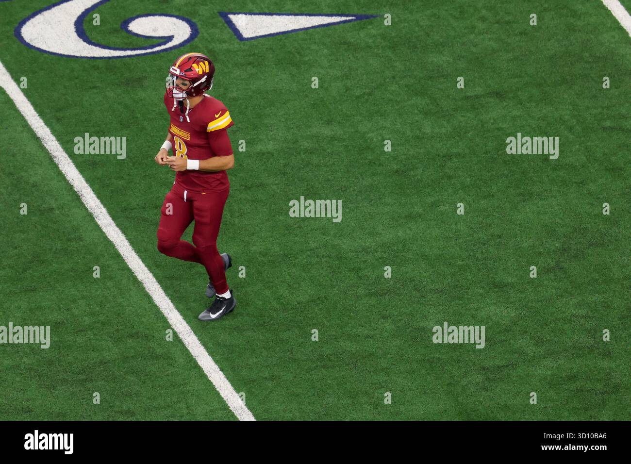 Washington Commanders quarterback Marcus Mariota (8) warms up before an ...