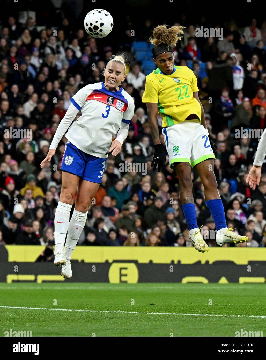 England's Alex Greenwood (left) and Brazil's Luany battle for the ball ...