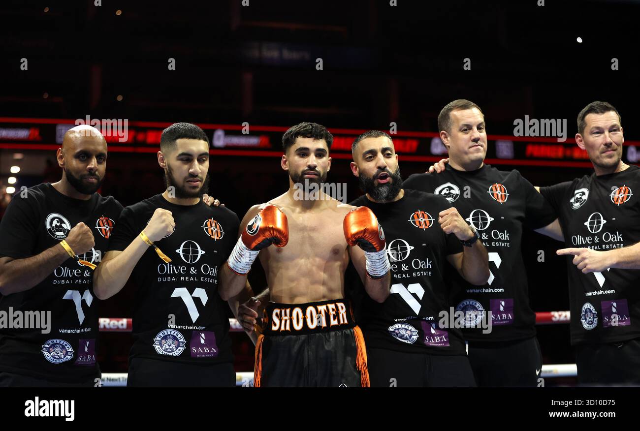 Hassan Ishaq (centre) after winning the super bantam weight bout ...