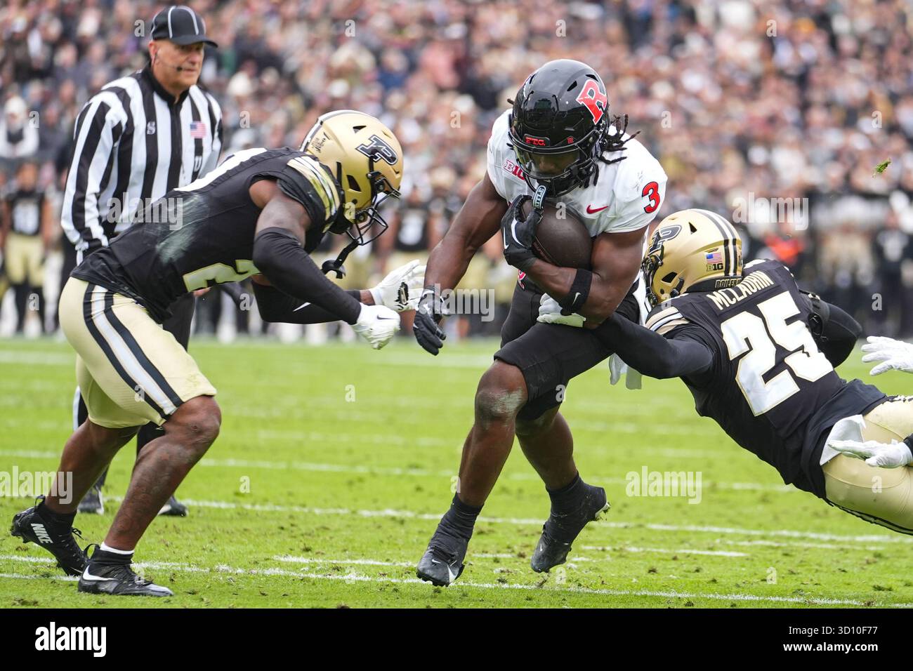 Rutgers running back Antwan Raymond (3) cuts between Purdue defensive ...