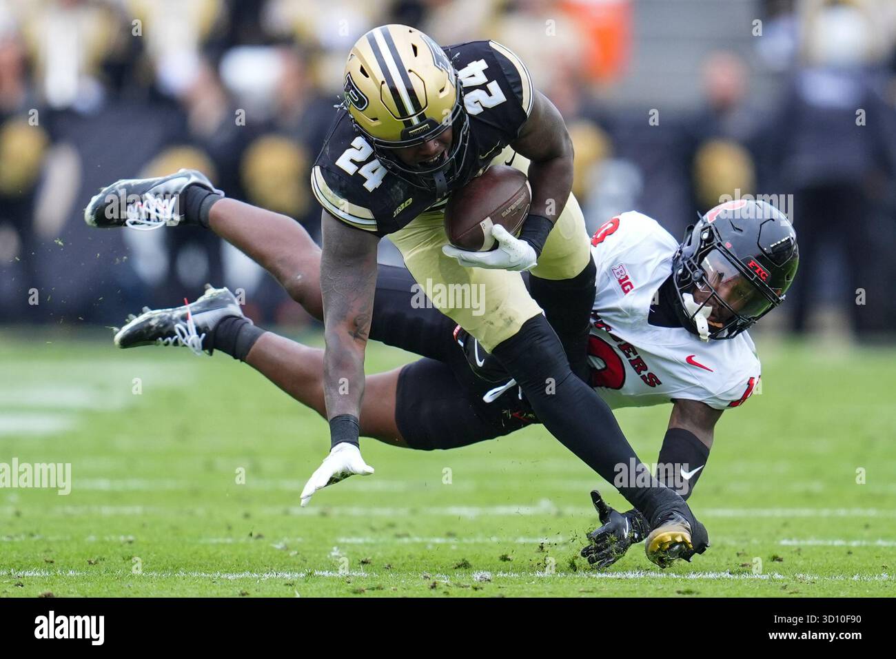 Purdue running back Malachi Thomas (24) is tackled by Rutgers defensive ...