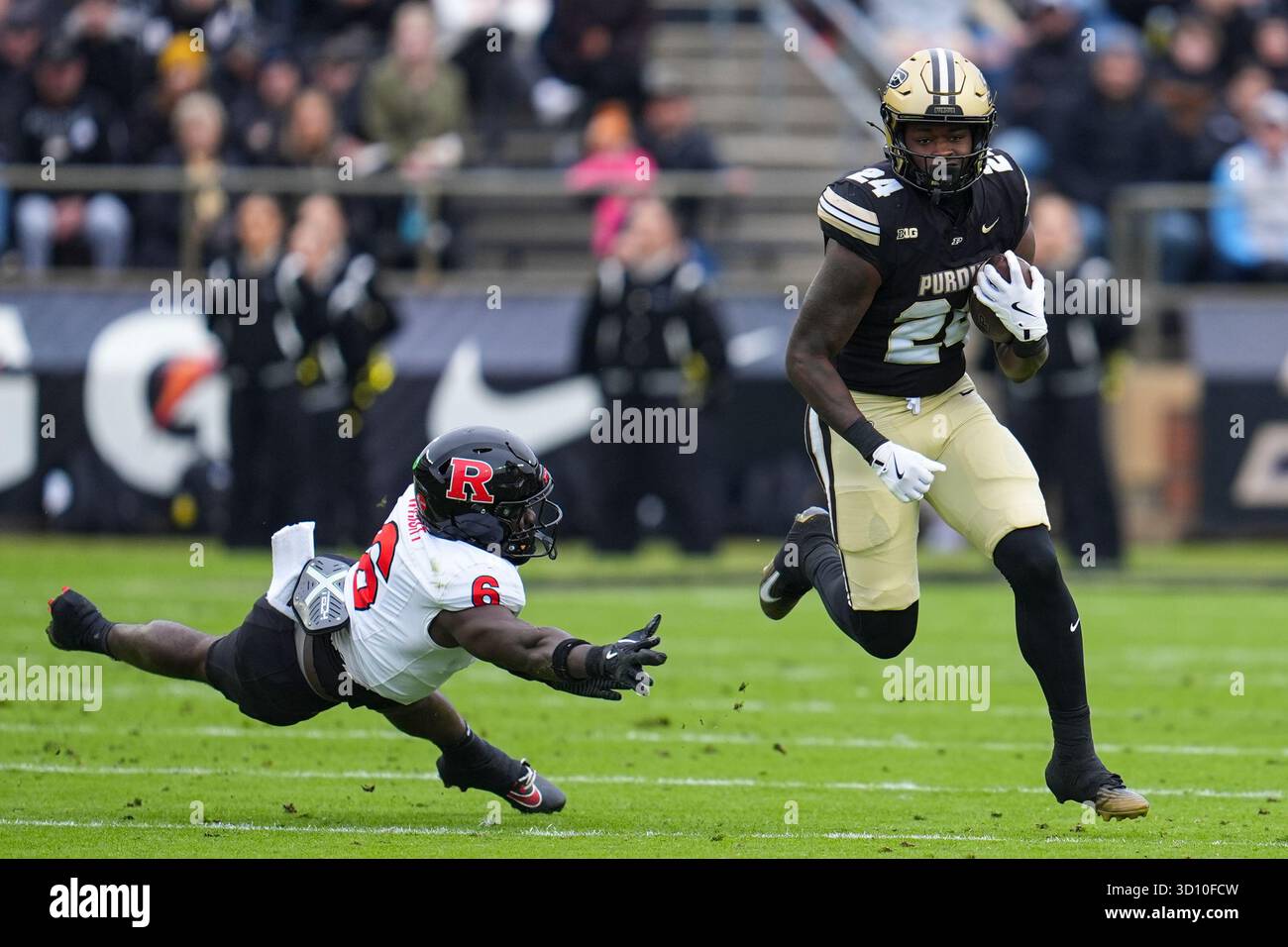 Purdue running back Malachi Thomas (24) gets past Rutgers linebacker ...