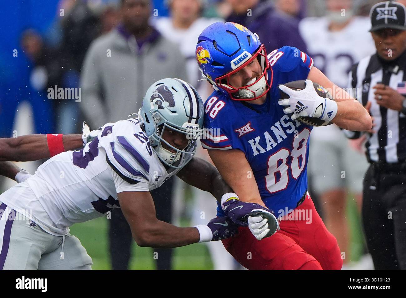 Kansas tight end Boden Groen (88) is pushed out of bounds by Kansas ...