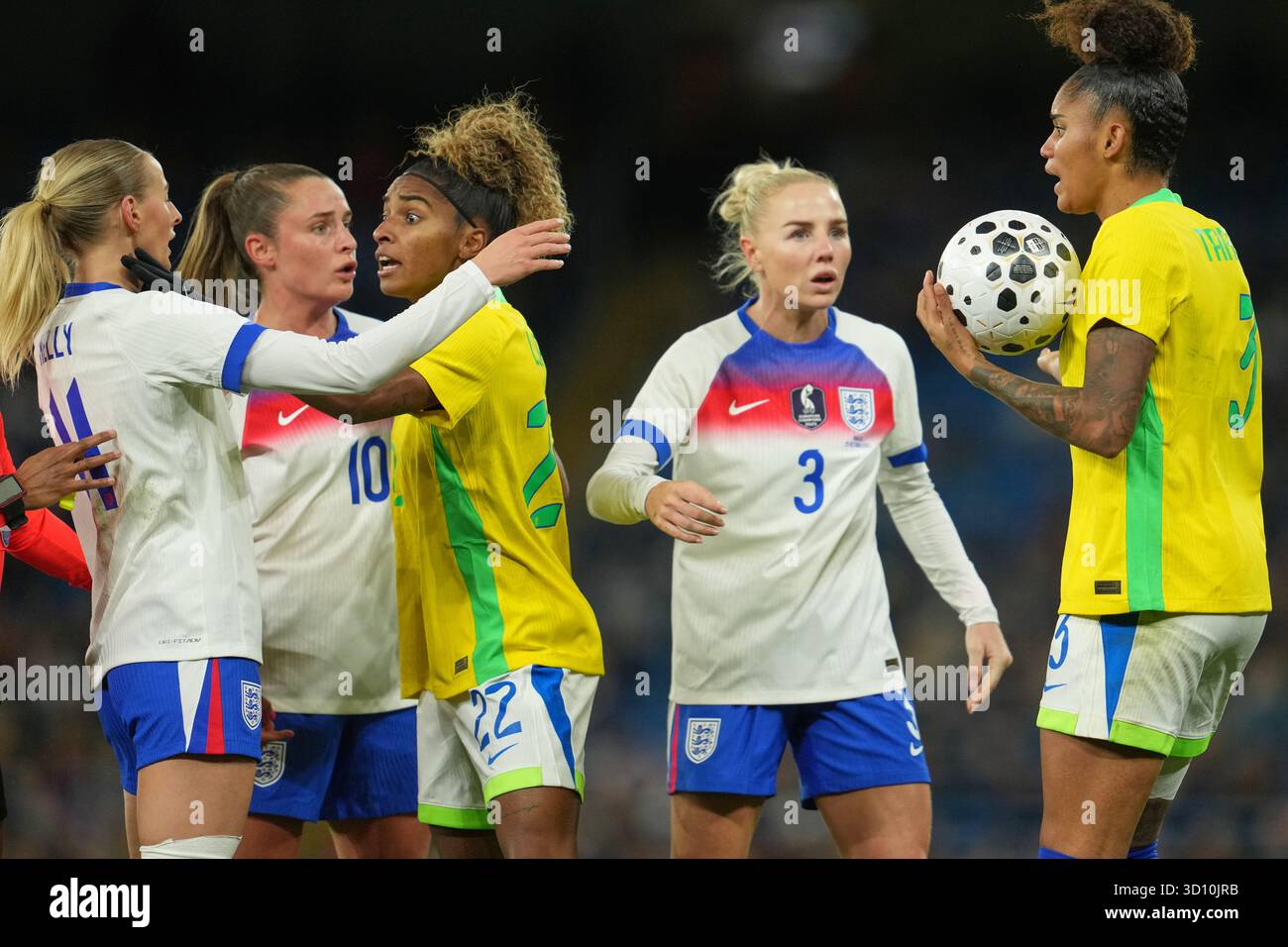 England's Chloe Kelly, left, argues with Brazil's Luany, centre, during ...