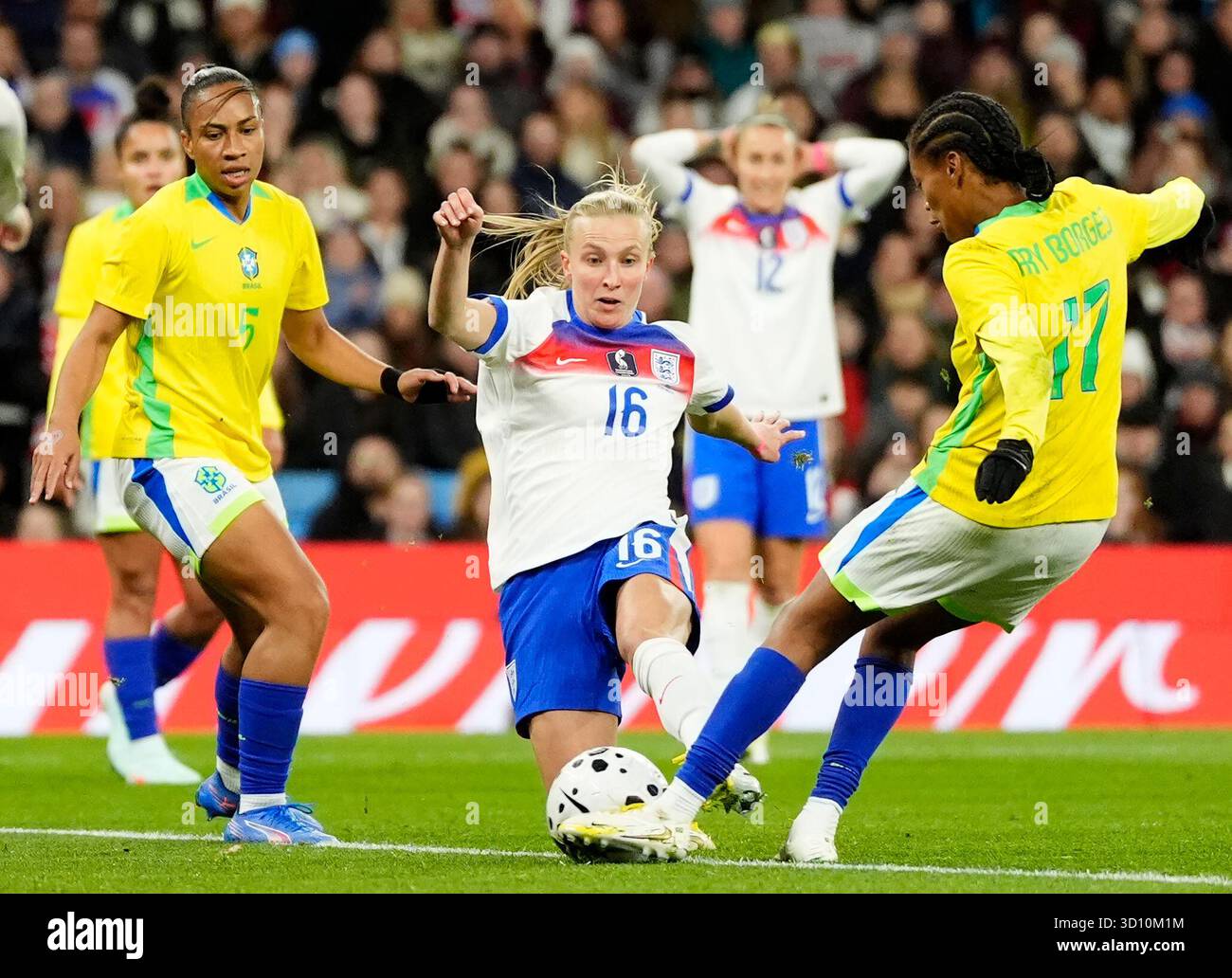 England's Aggie Beever-Jones (centre) has a shot blocked by Brazil's ...
