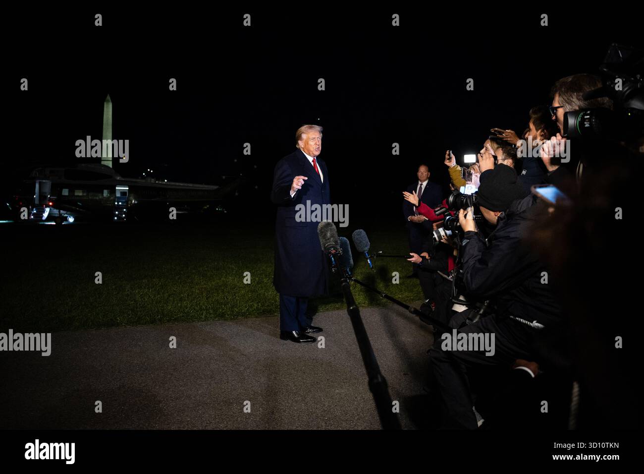 President Donald Trump speaks with reporters as he departs on the South ...