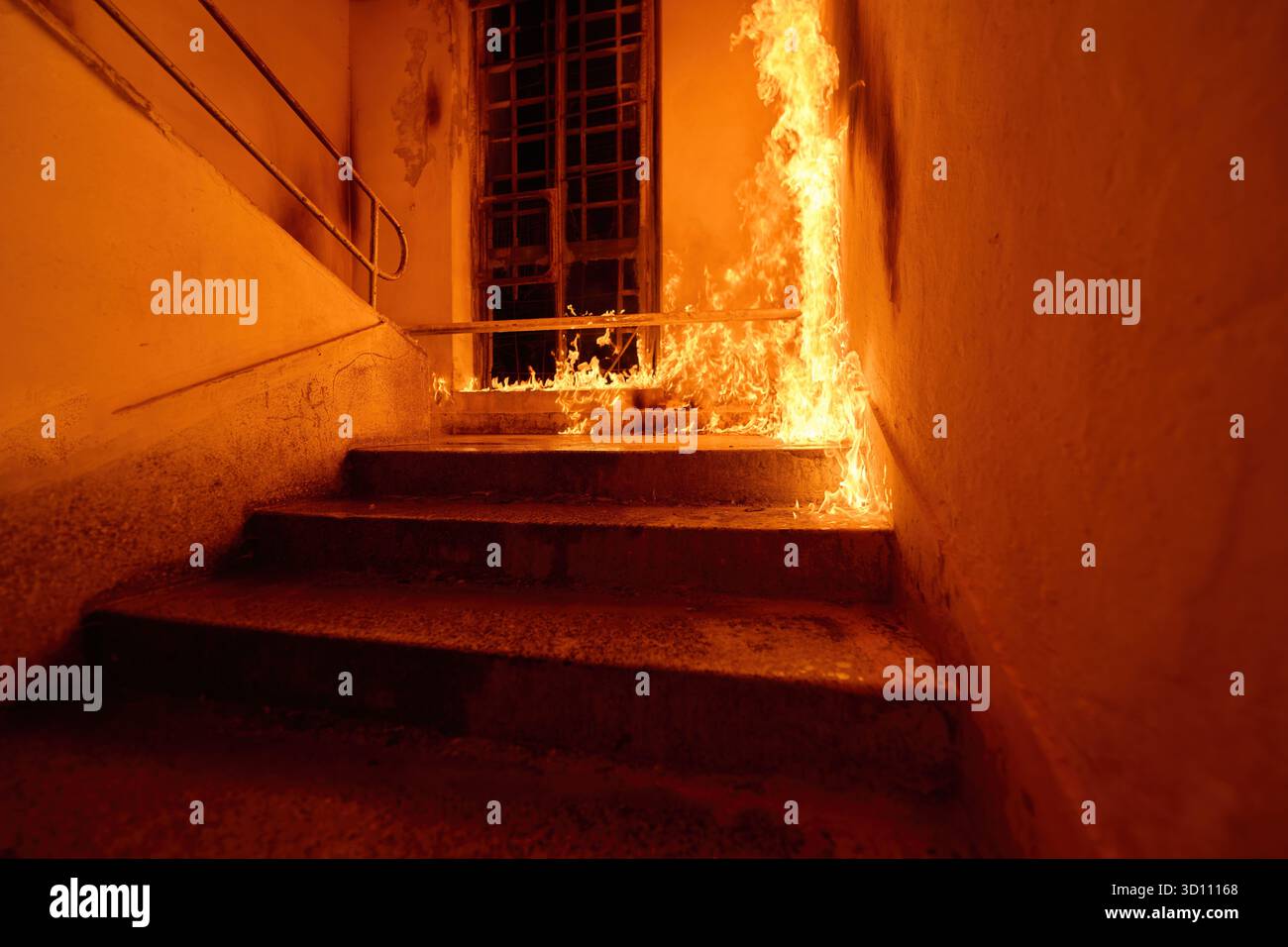 Fire engulfs staircase in abandoned building, flames blocking the ...