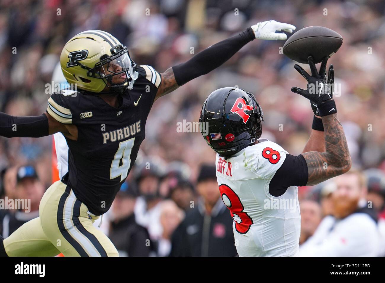 Purdue defensive back Hudauri Hines (4) breaks up a pass to Rutgers ...