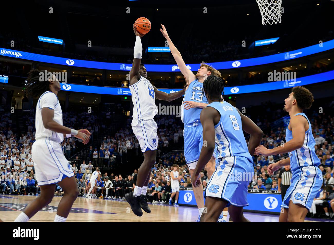 BYU center Keba Keita (13) shoots the ball over the defense of North ...