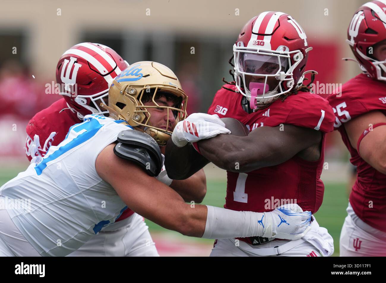 Indiana running back Roman Hemby (1) is tackled by UCLA defensive ...