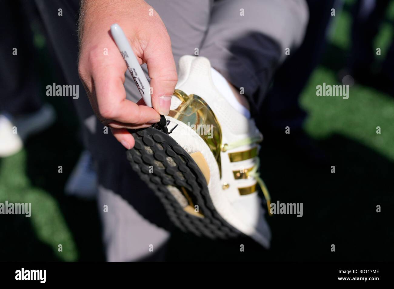 Georgia Tech head coach Brent Key marks his shoe with a win after an ...