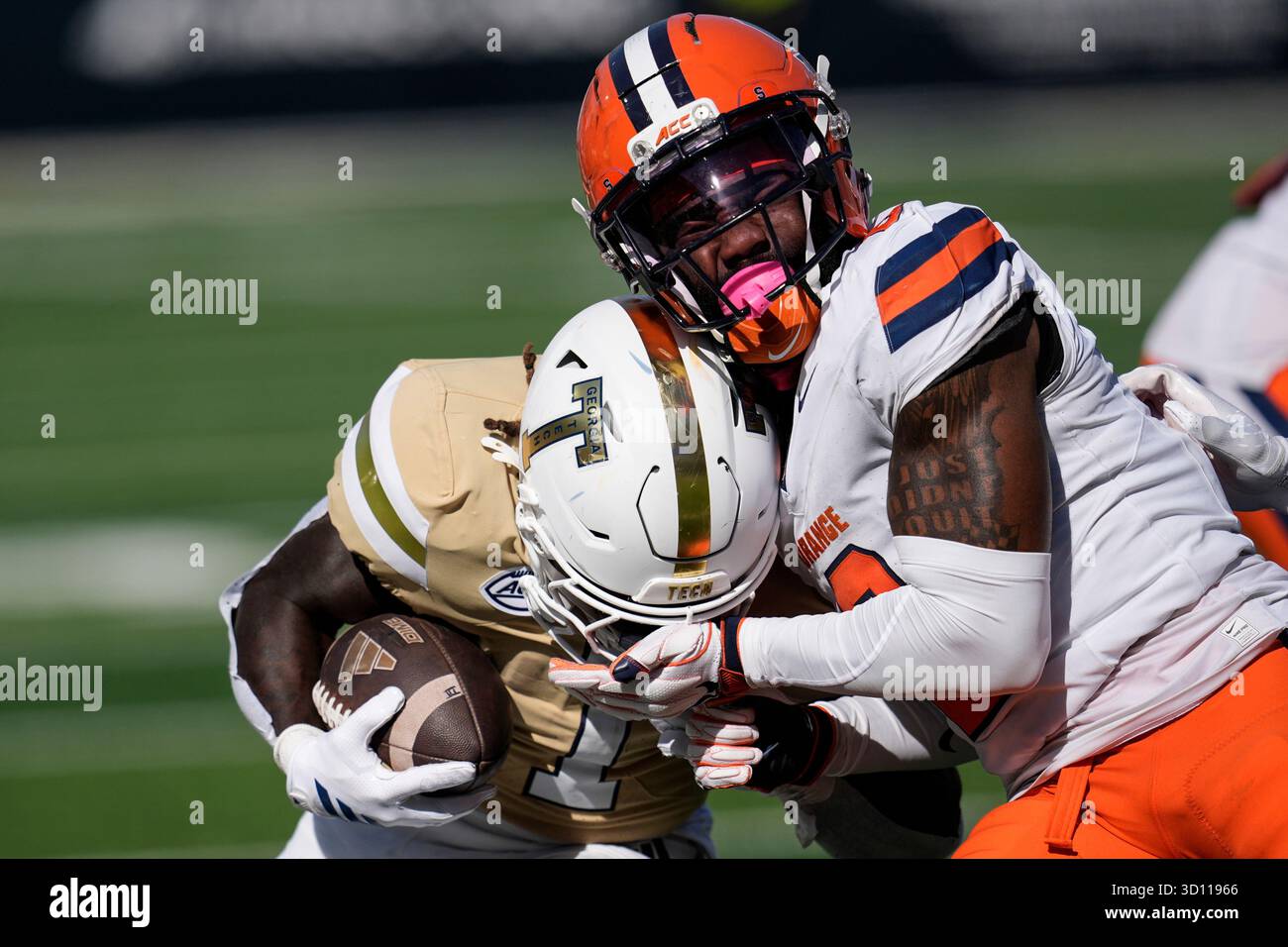 Syracuse cornerback Duce Chestnut (2) hits Georgia Tech running back ...