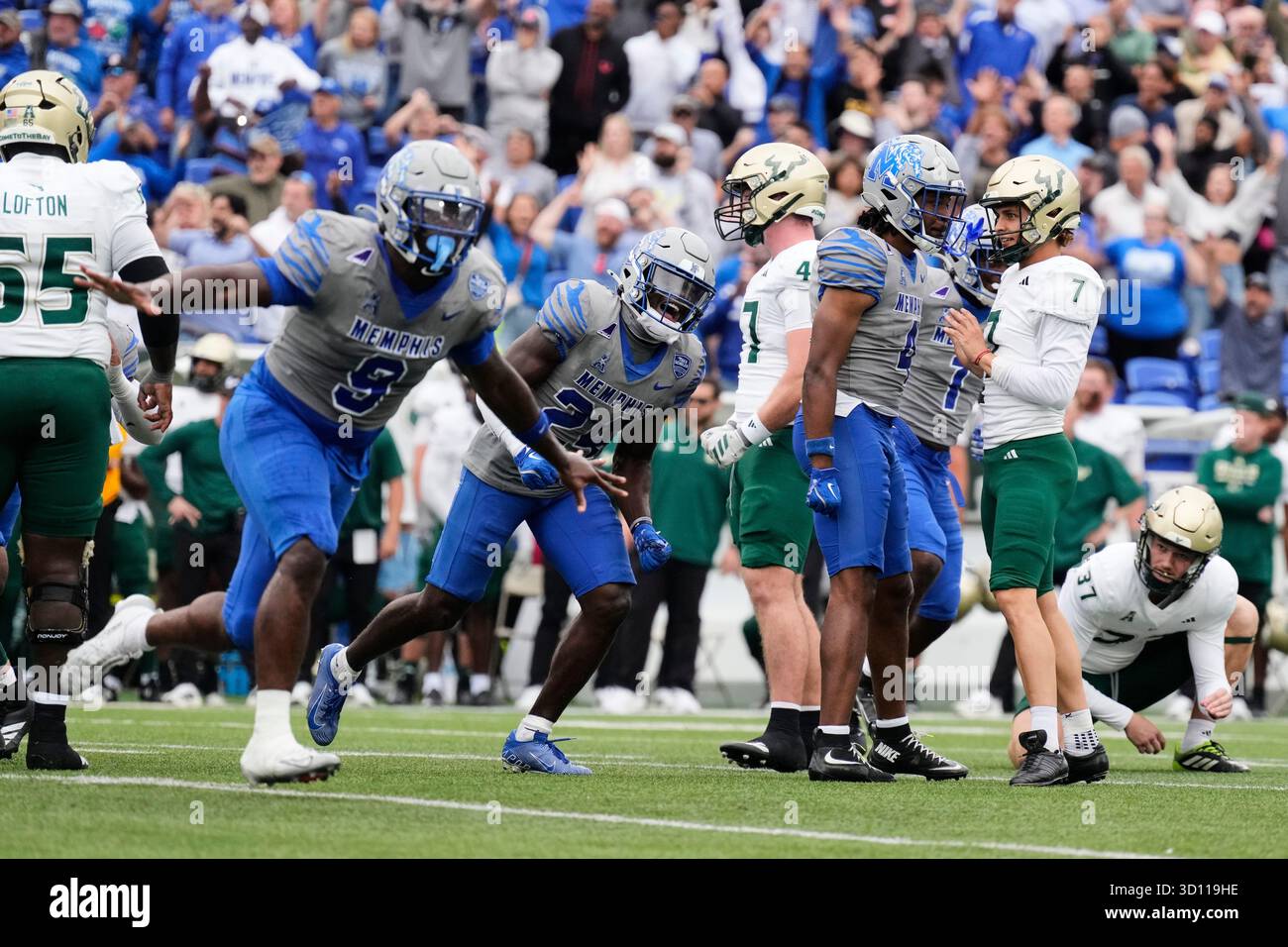 Memphis defensive lineman William Whitlow Jr. (9) and defensive back ...