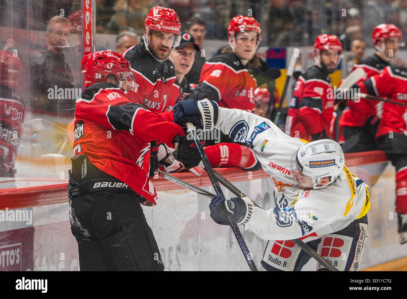 LAUSANNE, SWITZERLAND - OCTOBER 25: Manix Landry of Ambri R) against ...