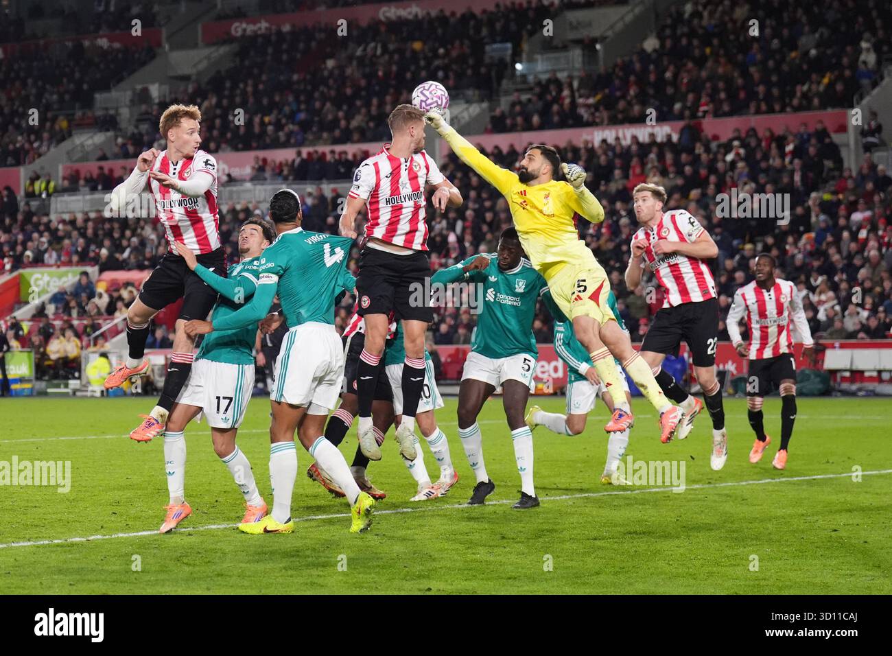 Liverpool goalkeeper Giorgi Mamardashvili (centre right) clears the ...