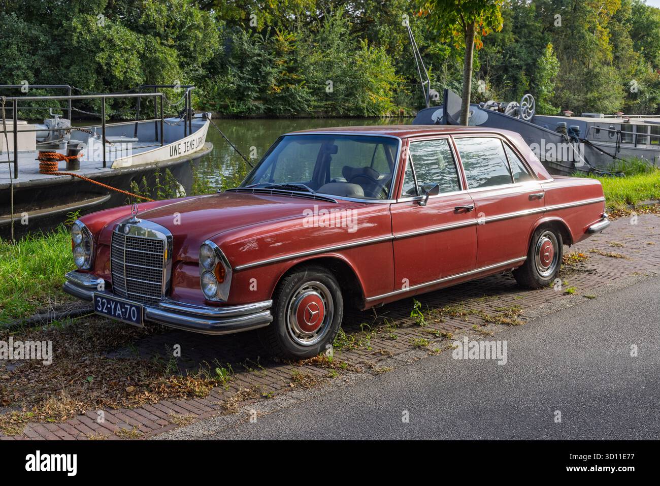 A vintage red Mercedes-Benz 280 S (W108/W109) classic car parked on the ...