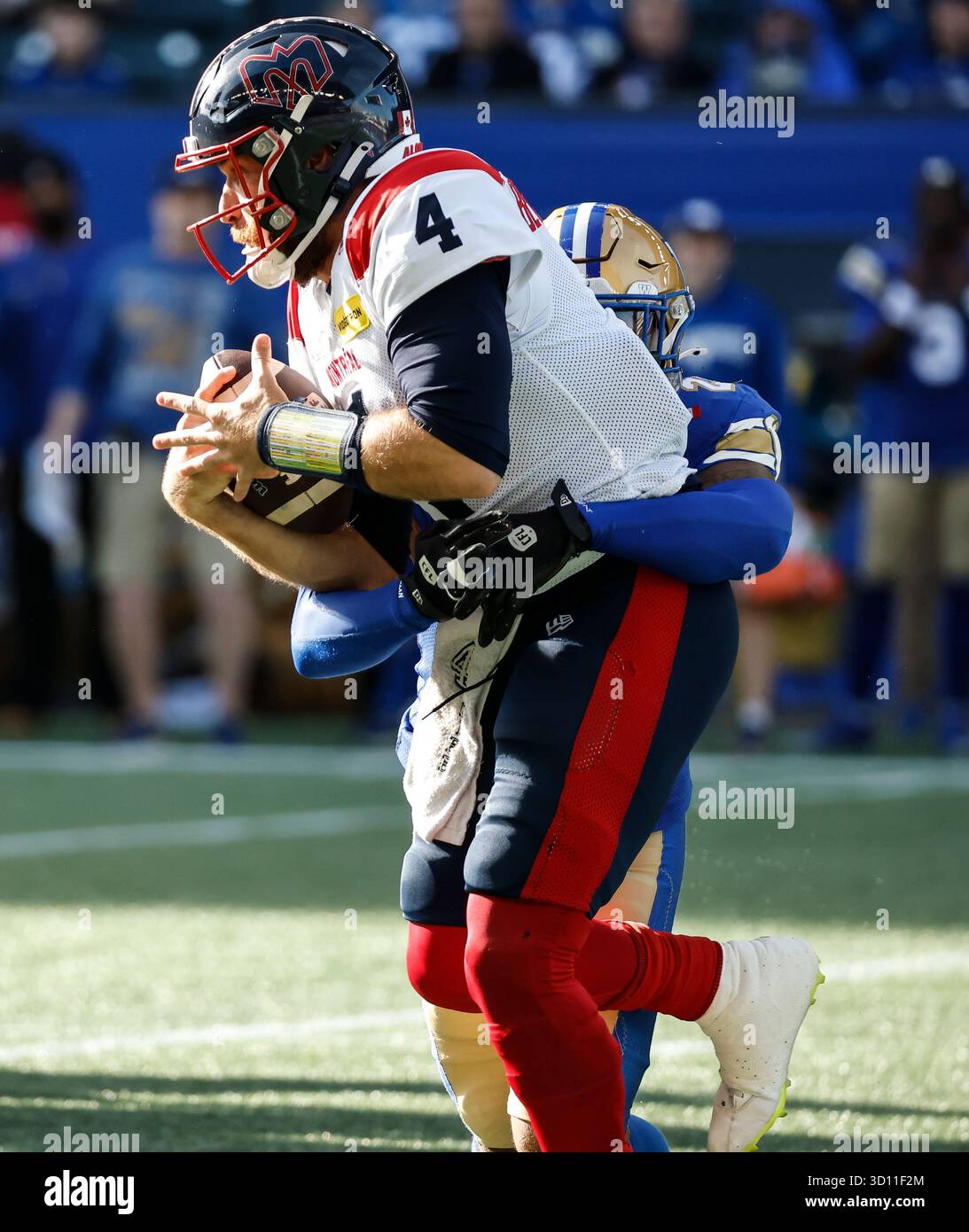 Winnipeg Blue Bombers' Jaiden Woodbey (26) tackles Montreal Alouettes ...