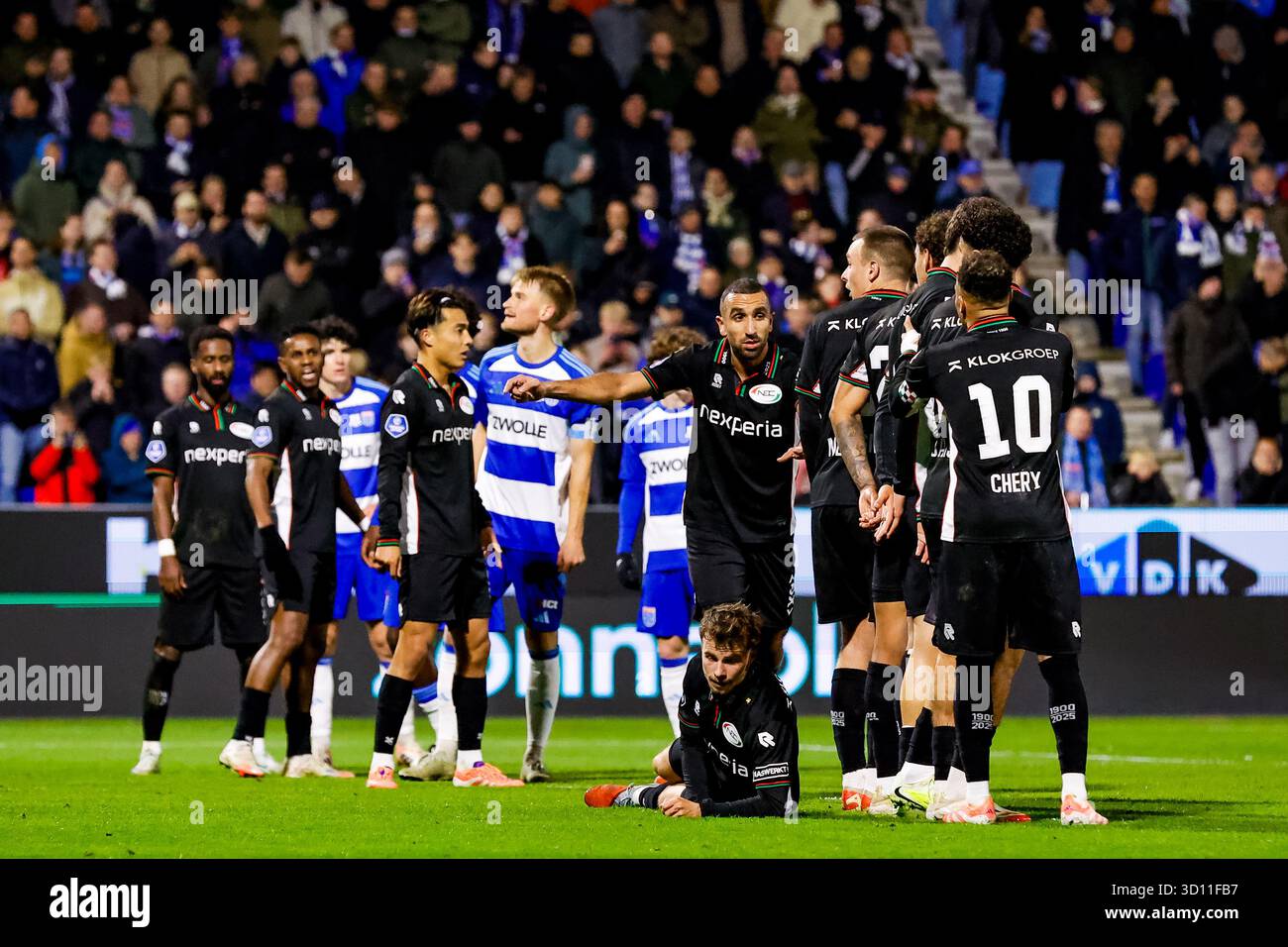 Zwolle - NEC Nijmegen players setting up a wall before a free kick ...