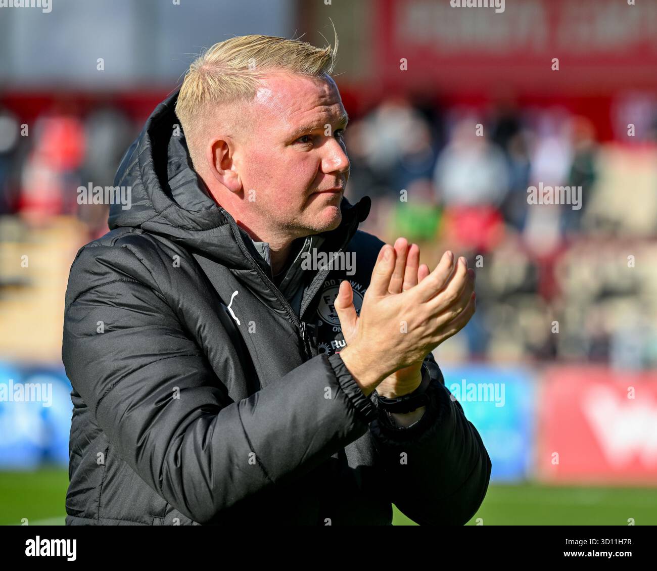 Pete Wild, manager of Fleetwood Town, clap the home supporters during ...