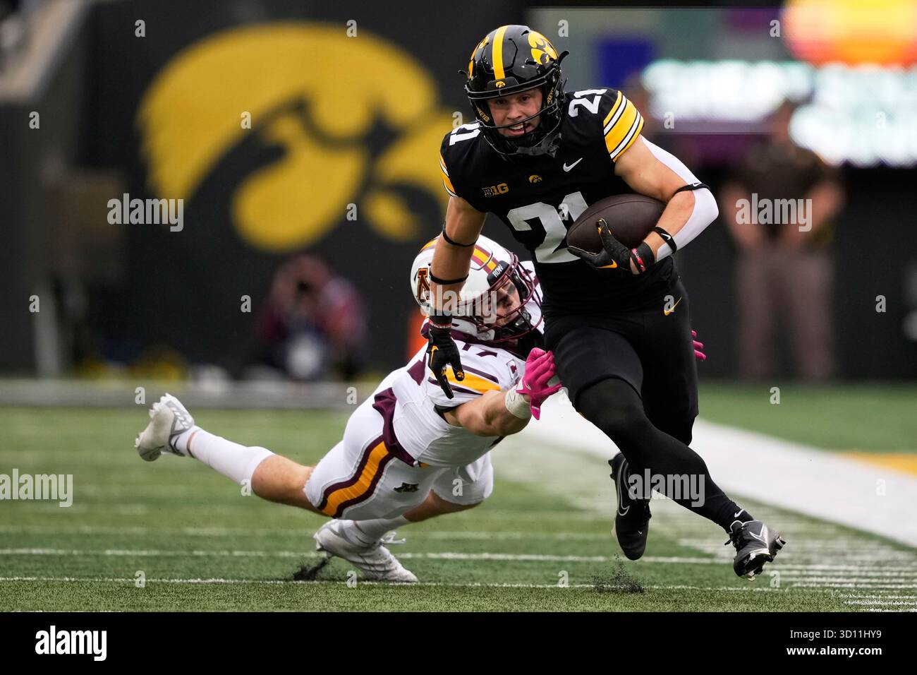 Iowa wide receiver Kaden Wetjen (21) runs from Minnesota defensive back ...
