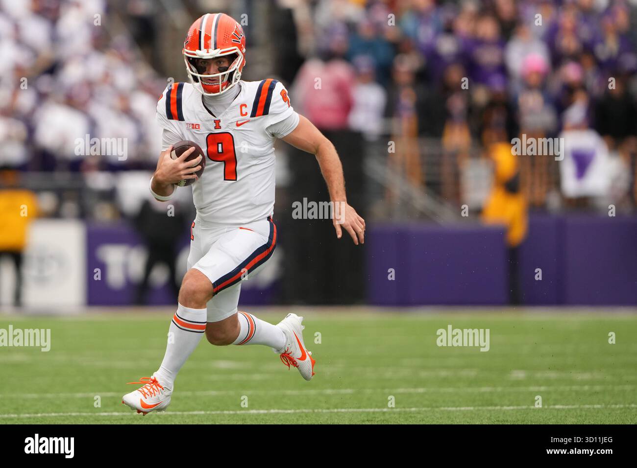 Illinois quarterback Luke Altmyer (9) runs the ball against Washington ...