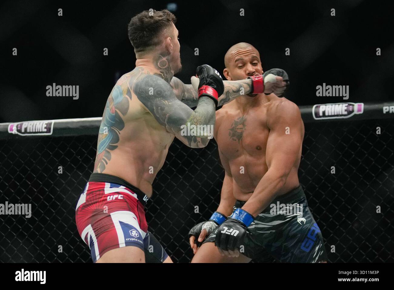 England's Tom Aspinall, left, punches Ciryl Gane of France during a ...