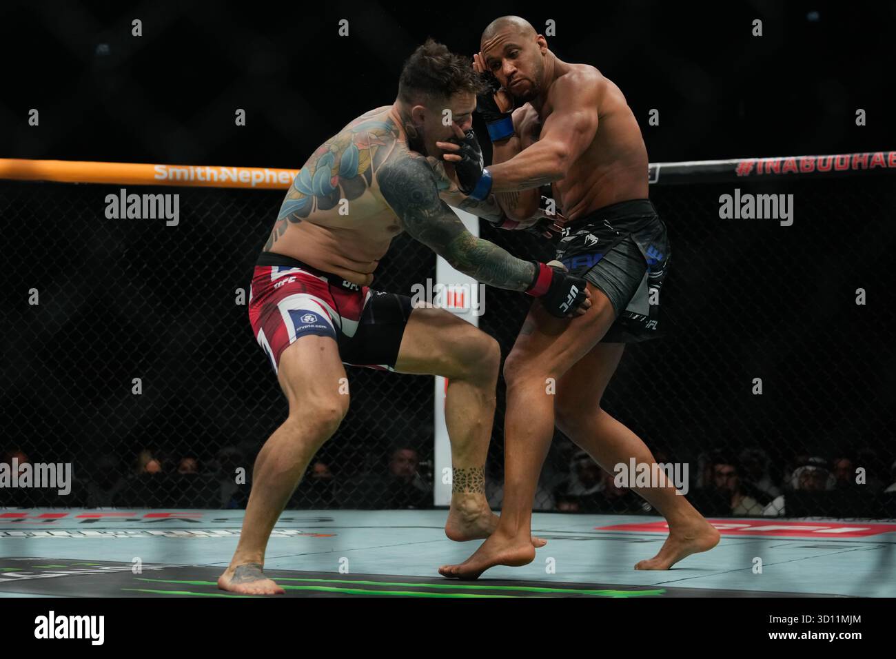 England's Tom Aspinall, left, fight Ciryl Gane of France during the ...