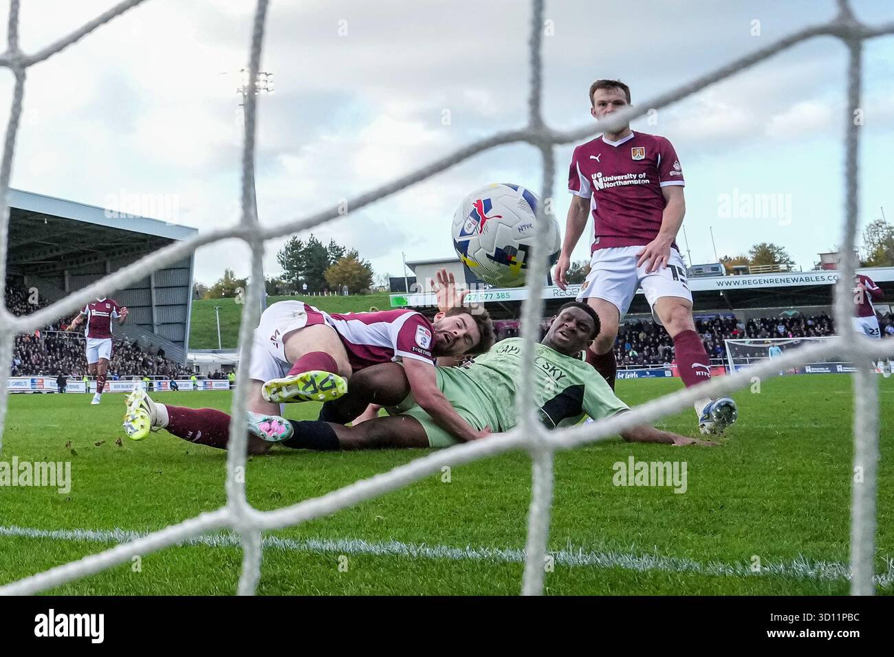 Lamine Fanne (22) of Luton Town (2nd right) scores the opening goal ...