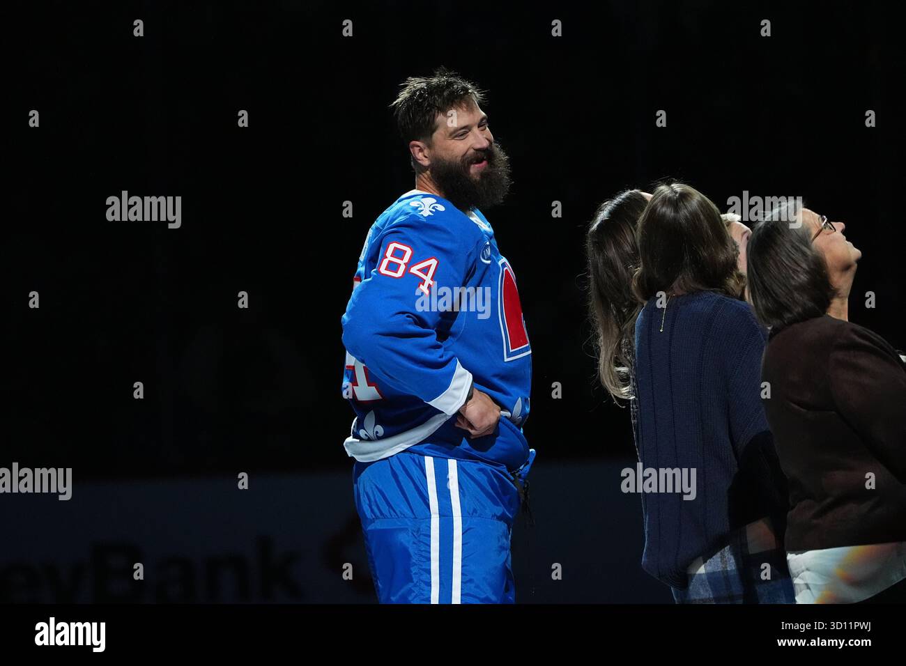 Colorado Avalanche defenseman Brent Burns (84) jokes with his family as ...