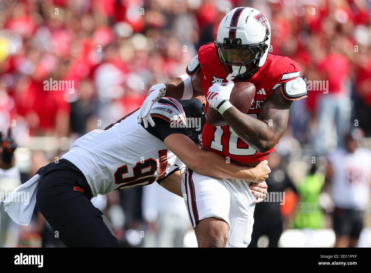Texas Tech wide receiver Roy Alexander, right, is tackled after ...
