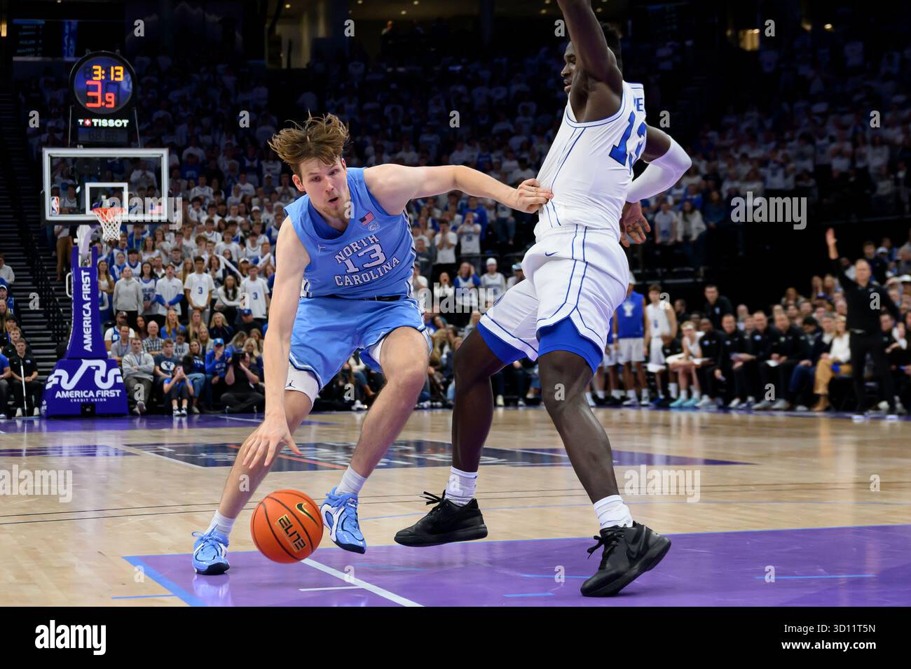 North Carolina center Henri Veesaar (13) drives to the basket guarded ...