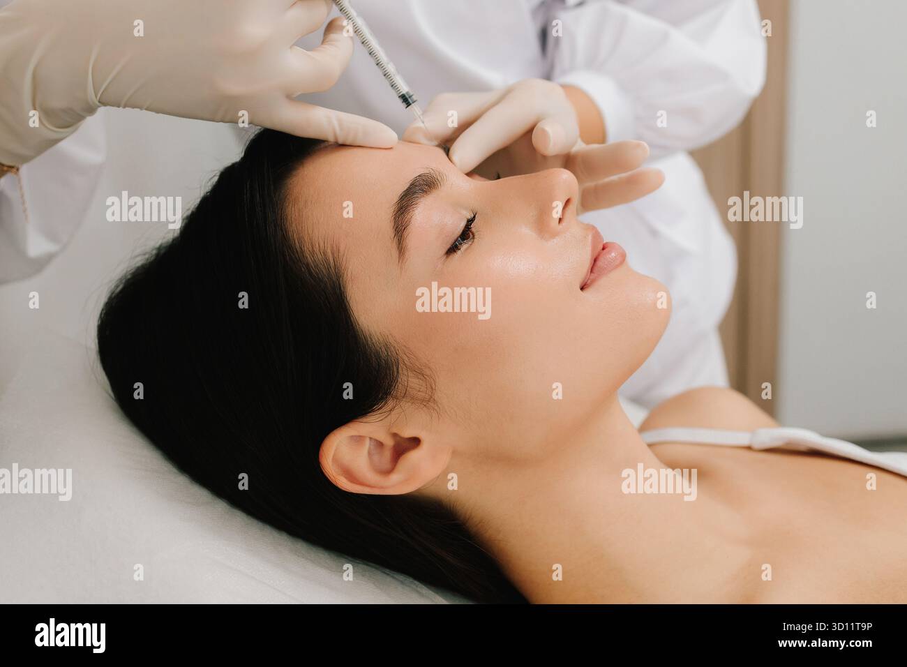 Glabellar Botulinum Toxin Injection close-up. Anti-wrinkle therapy ...