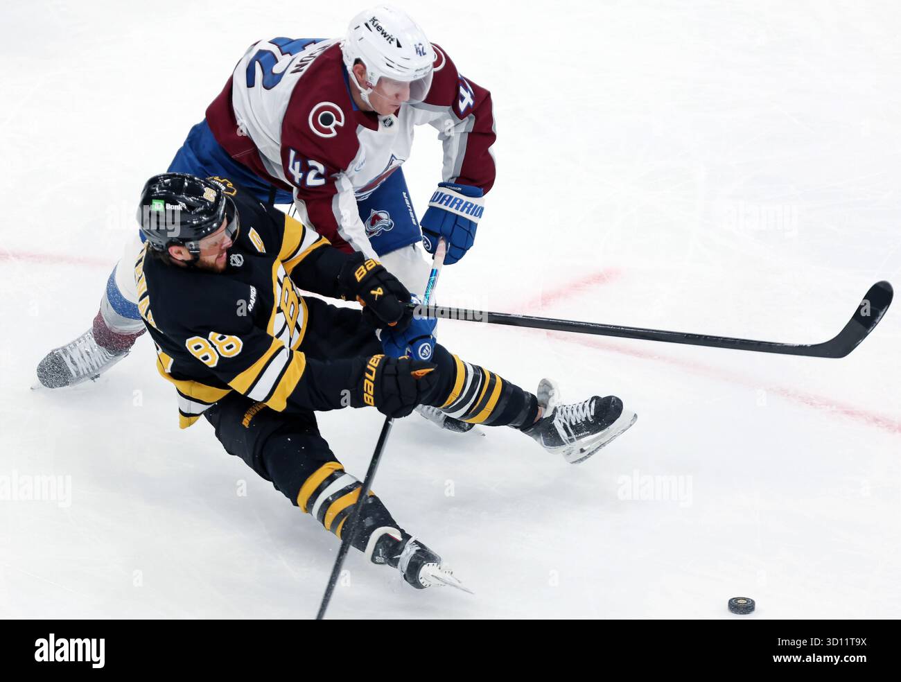 Boston Bruins forward David Pastrnak is taken down by Colorado ...