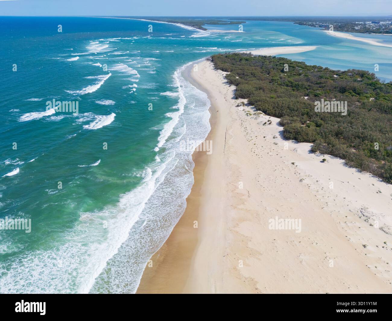Aerial view of a coastal breakthrough along a white sandy shoreline at ...