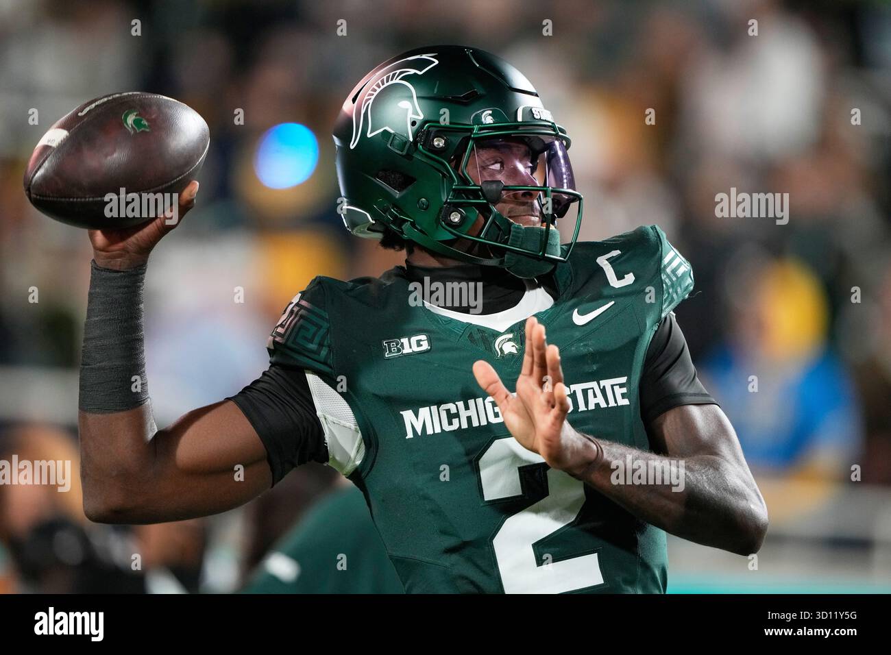 Michigan State quarterback Aidan Chiles warms up before an NCAA college ...