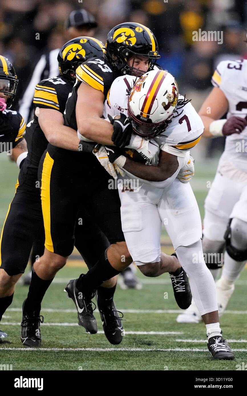 Minnesota running back Fame Ijeboi (7) is tackled by Iowa linebacker ...