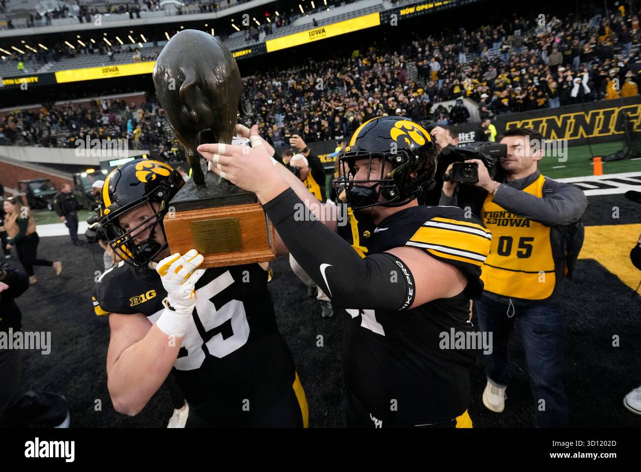 Iowa defensive lineman Aaron Graves, left, and teammate Jonah Pace ...